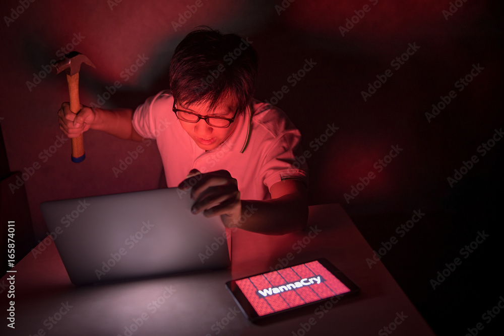 Foto de Ransomware victim angry with file lock on his computer laptop ...