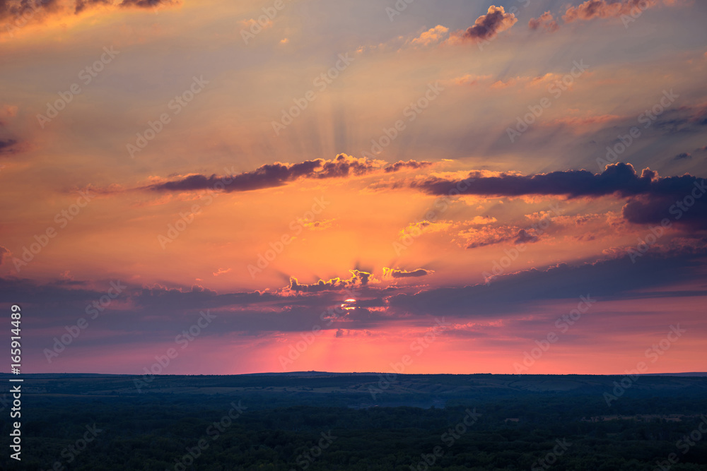 Sunset over the hill. Beautiful cloudy landscape. Natural background ...