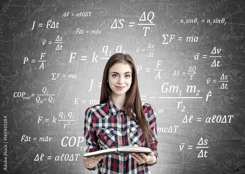 Beautiful nerd girl with a book, physics formulas Stock Photo | Adobe Stock