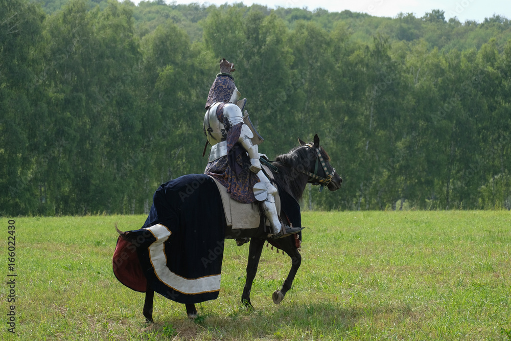 Medieval knight in armor on horseback Stock Photo | Adobe Stock