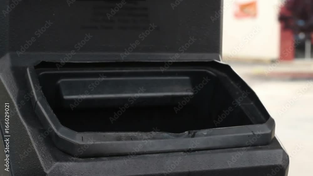 Man picks up a Squeegee from its container at a gas station Stock ビデオ ...