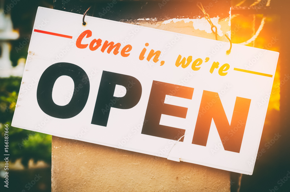 Come in,we 're OPEN old sign hanging in front of coffee cafe shop ...