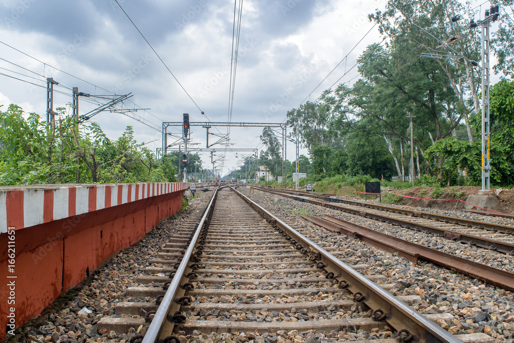 July 27, 2017. Train tracks of the Indian railways running through ...