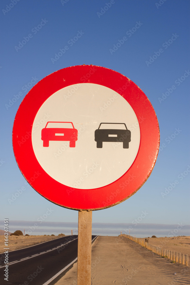 No overtaking. Prohibited to advance indicating. Round red traffic sign ...