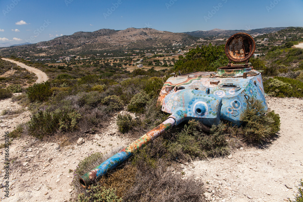 Destroyed tank on the hill. Old upper part of the tank remains after ...