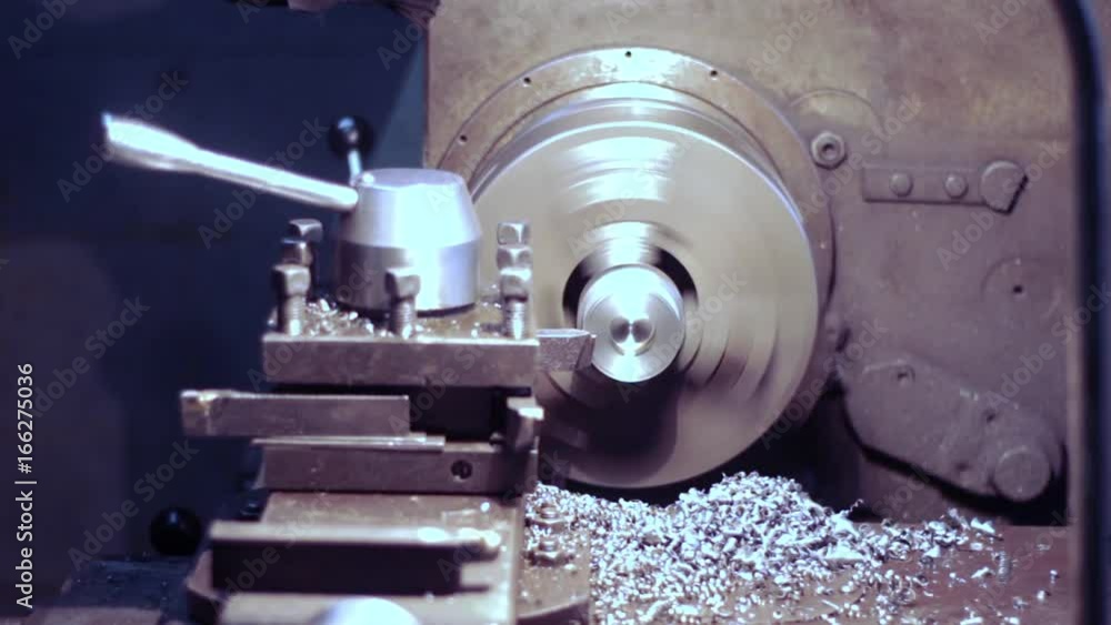 CNC Milling Machine Produces Metal Detail on Factory. The part turns ...