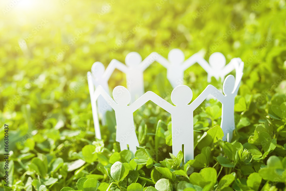 Group of paper people holding hands together. Concept of social help in ...