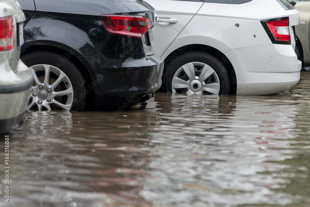 car in water after heavy rain and flood Stock Photo | Adobe Stock
