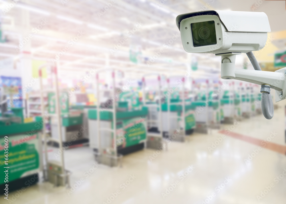 CCTV camera security in shopping mall and supermarket blur background ...