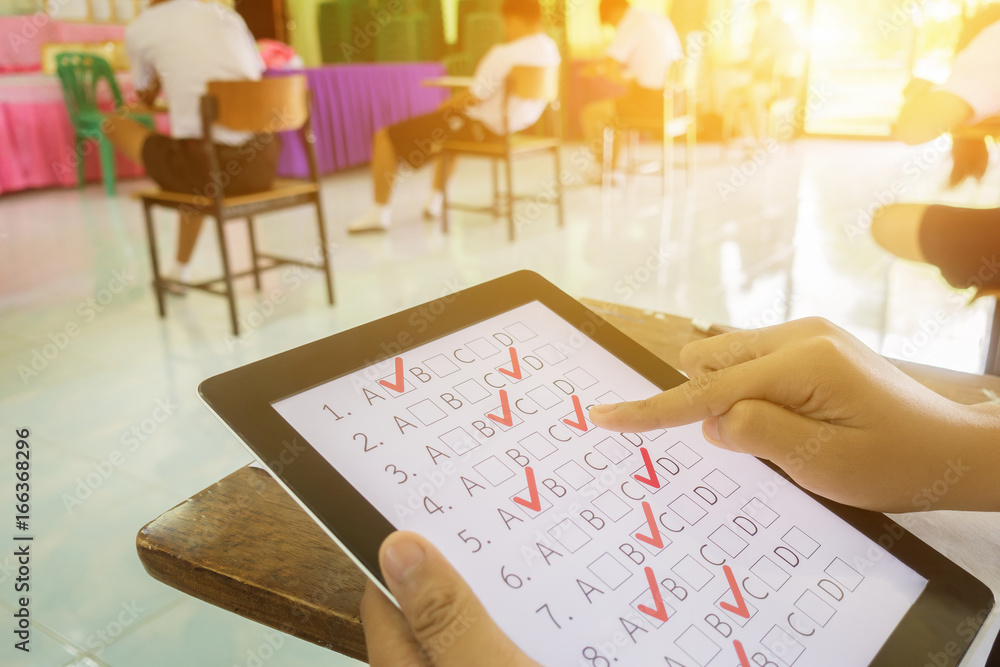 education technology concept, finger student clicking testing in ...