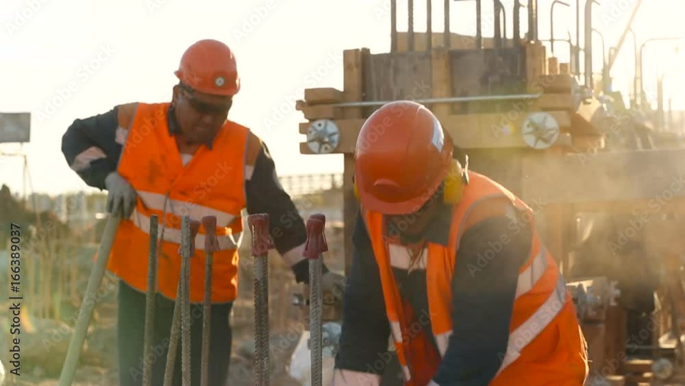 Building Site. Men Working on the Ground. Man Cutting Stone Using ...
