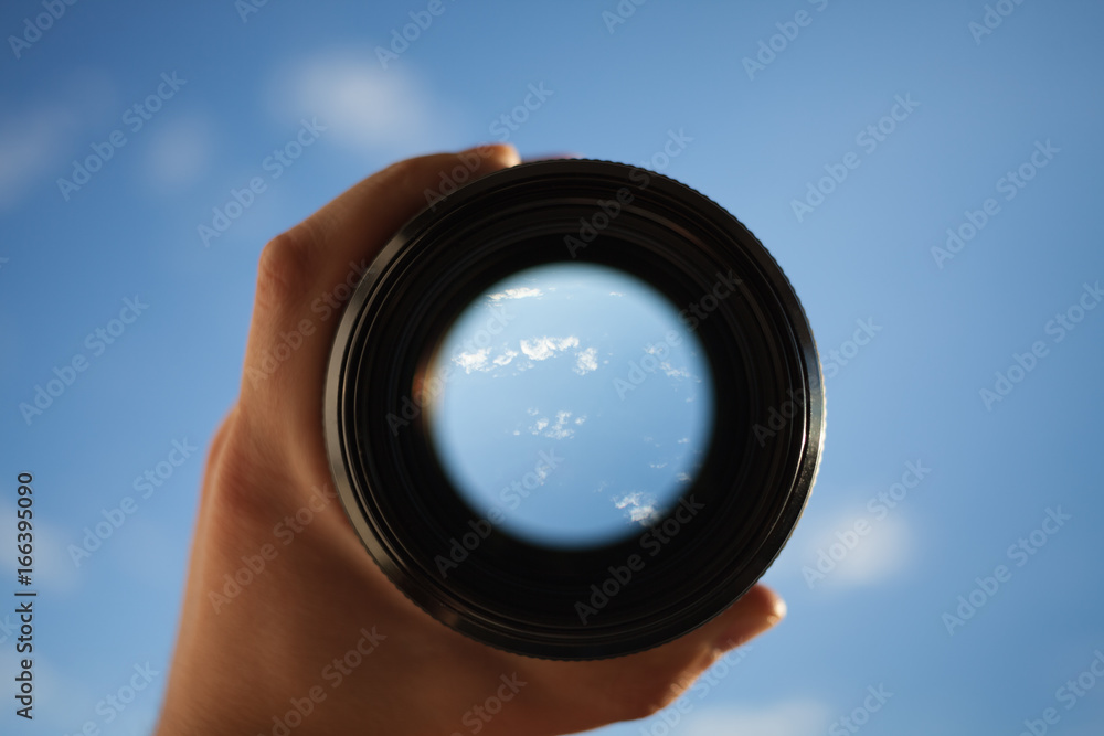 View through spyglass lens to the white clouds in the sky Stock Photo ...