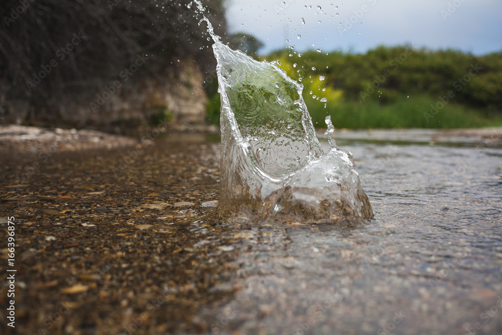 Water splash in a small stream. Stock Photo | Adobe Stock