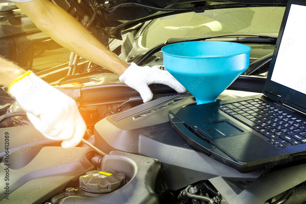 Car repairing,Hands of technician using wrench repair engine with a ...