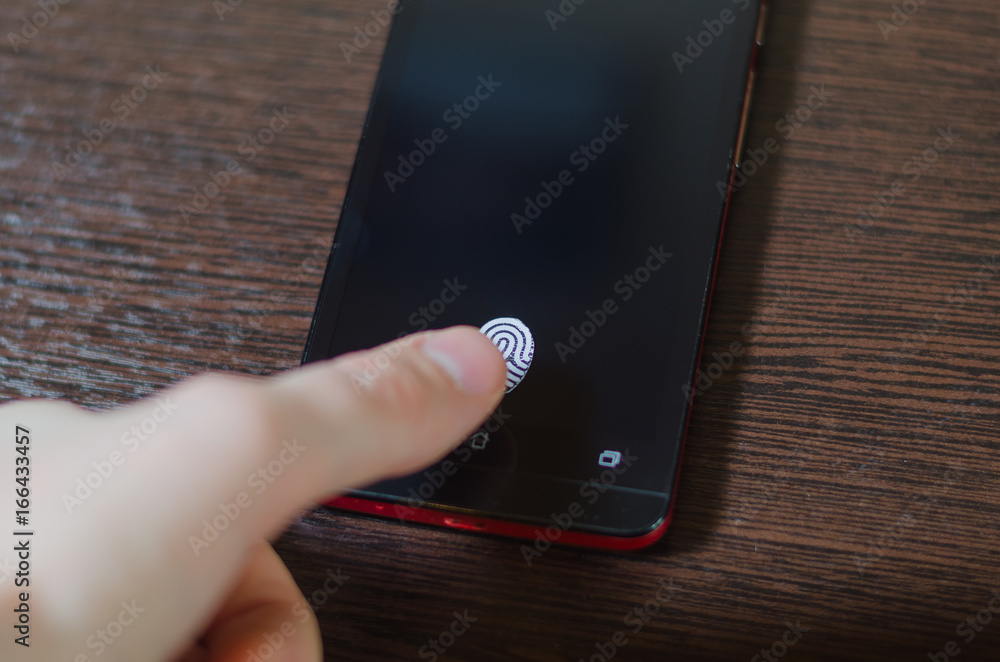 Fingerprint scanner on the phone screen. Touch screen smartphone with a ...