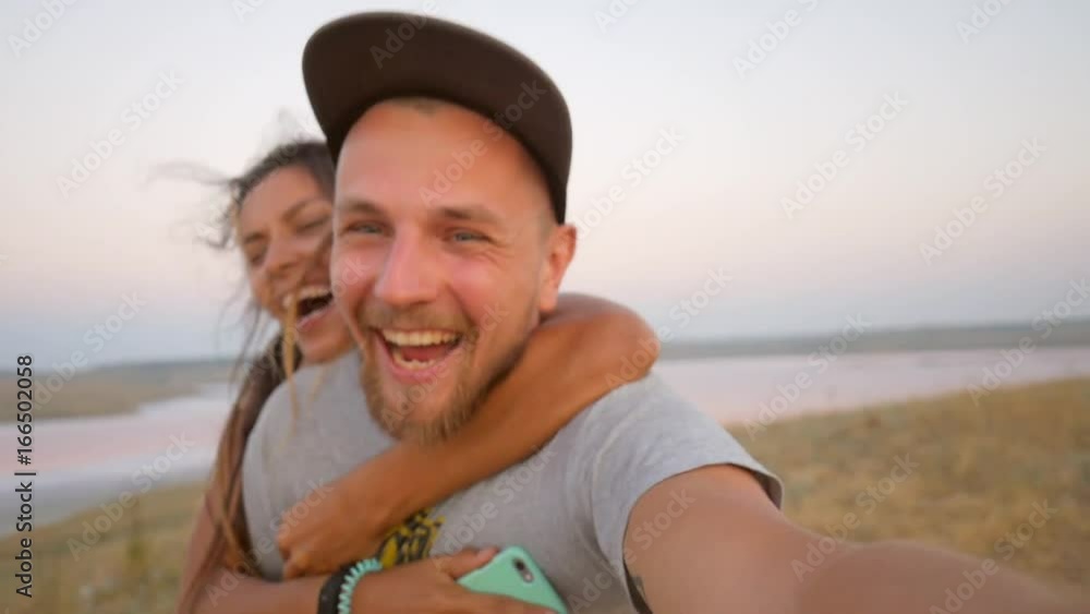 Young mixed race couple running piggyback and having fun. HD Slowmotion ...