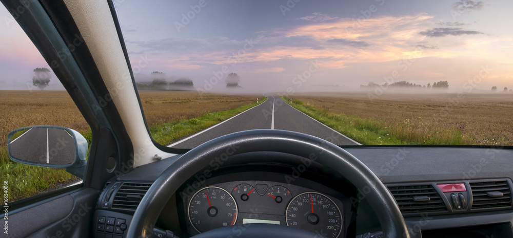 A view of the cockpit of a car driving .The way in the morning. Stock ...
