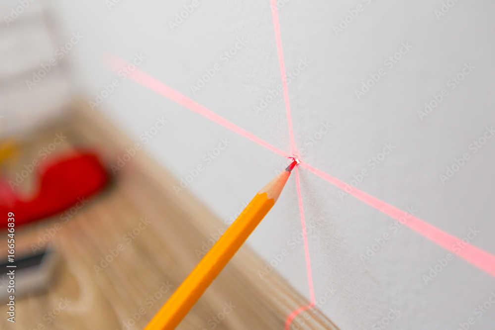 Laser level and lines on the wall Stock Photo | Adobe Stock