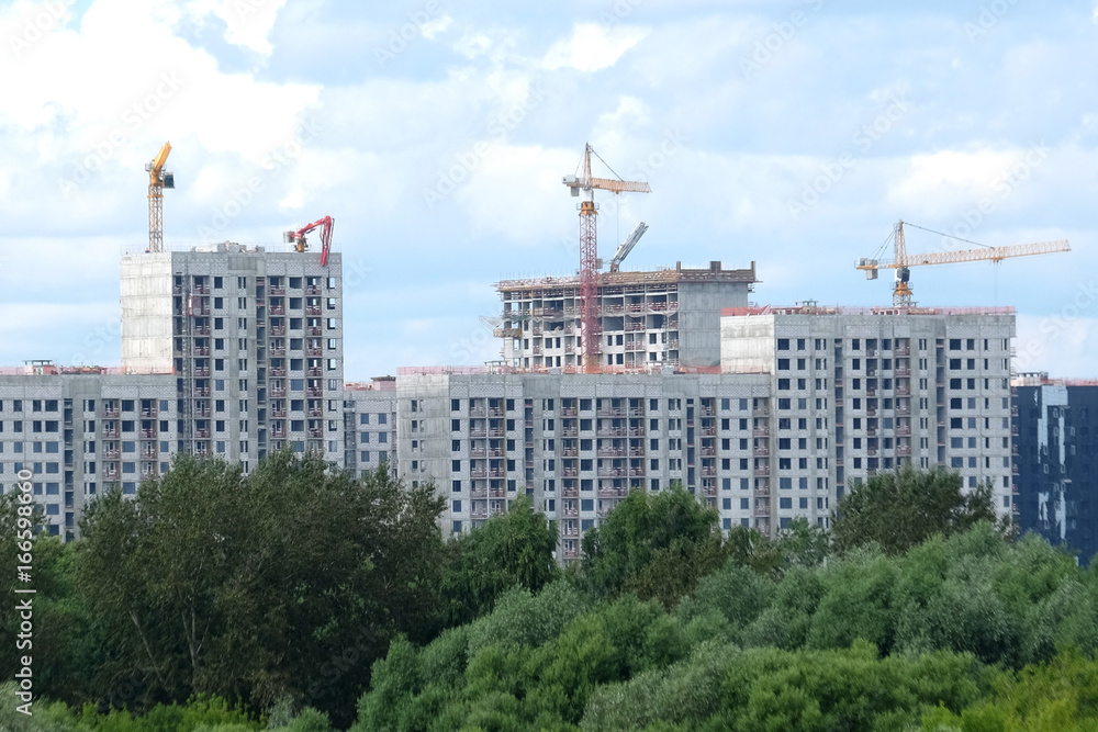 City construction. Landscape with new block of flats construction in ...