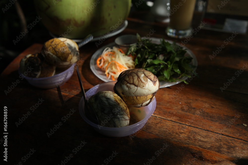 Balut (boiled developing duck embryo) in Hoi An, Vietnam. This is a ...