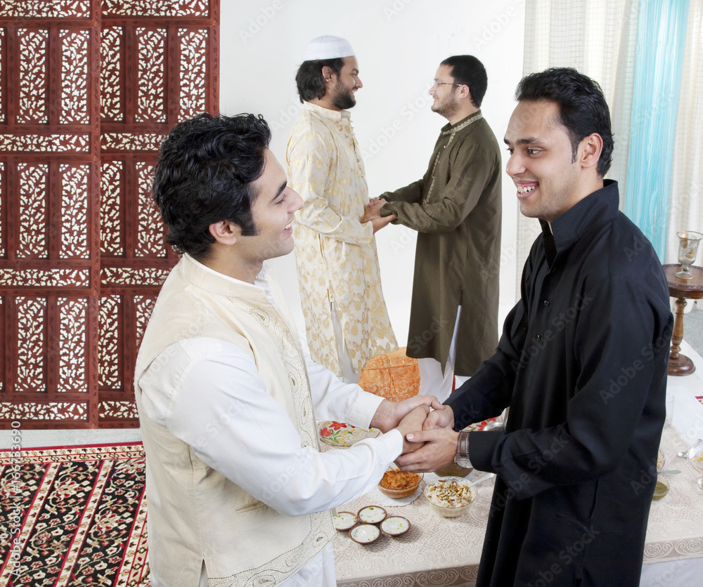 Muslim men greeting each other Stock Photo | Adobe Stock