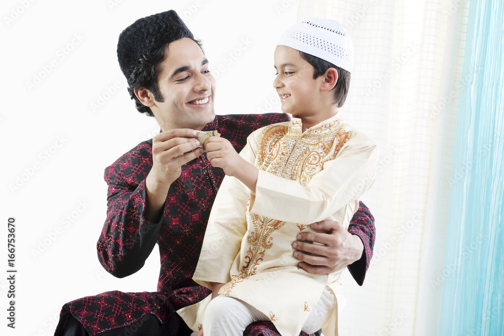 Muslim father and son Stock Photo | Adobe Stock