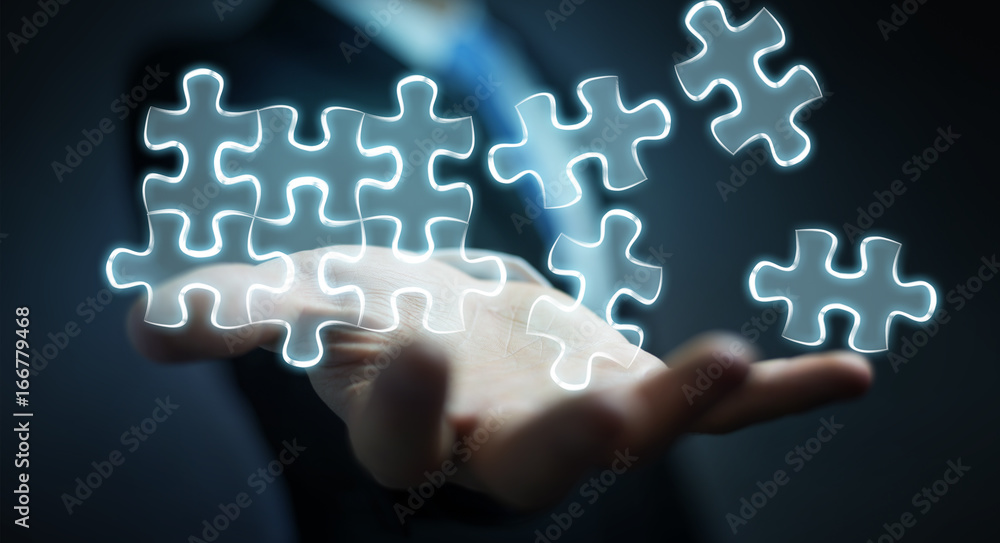 Businessman holding hand-drawn puzzle pieces Stock Photo | Adobe Stock