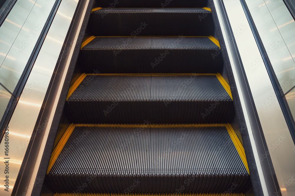 Empty escalator or moving stair. Also called stairway or staircase ...