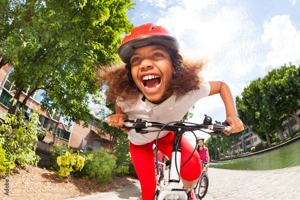Preteen African girl racing in full speed Stock Photo | Adobe Stock
