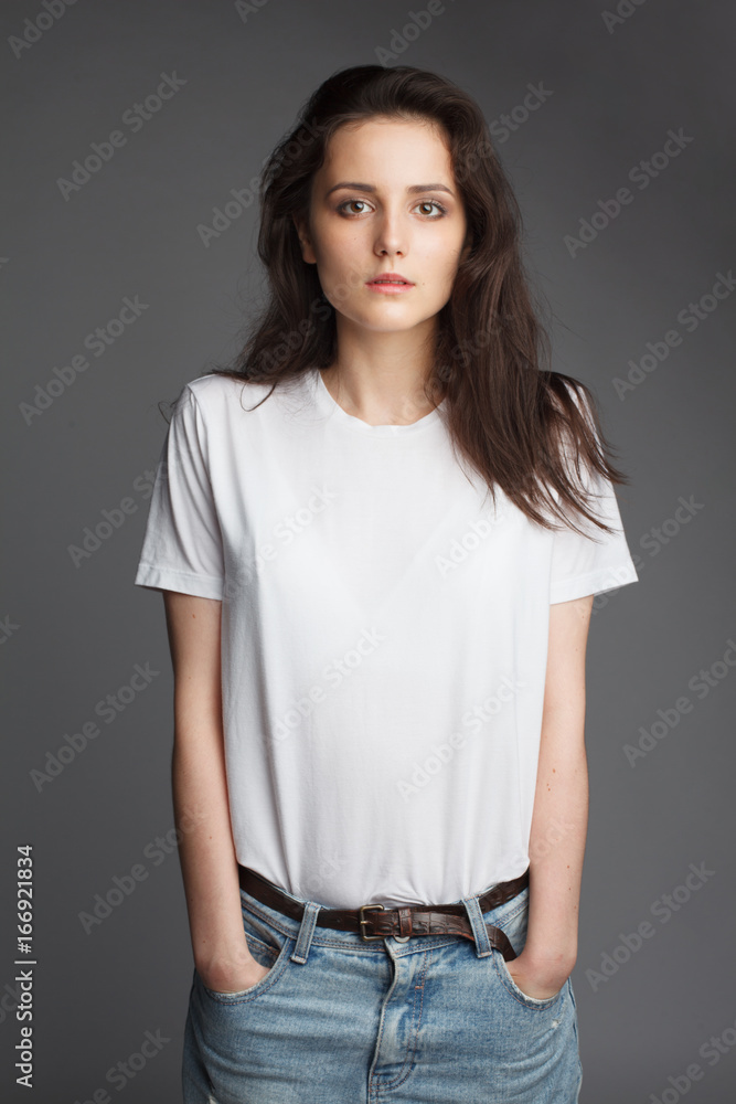 attractive female model front view in blank white t-shirt and jeans ...