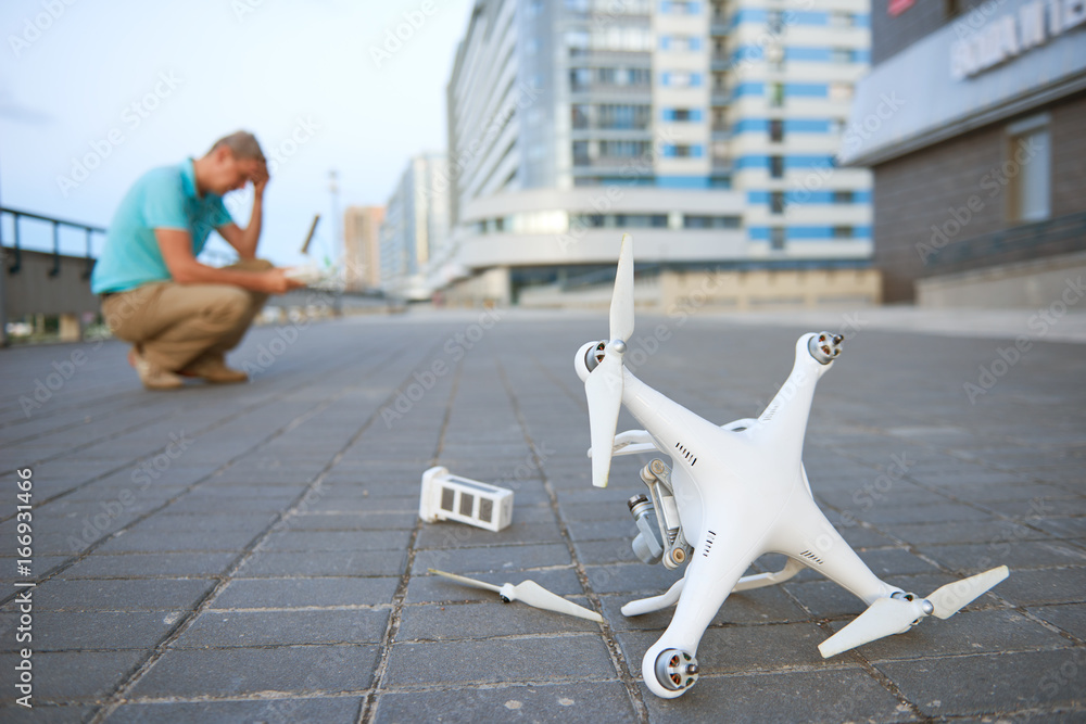 Drone crash. Fallen damaged quadrocopter in city Stock-Foto | Adobe Stock