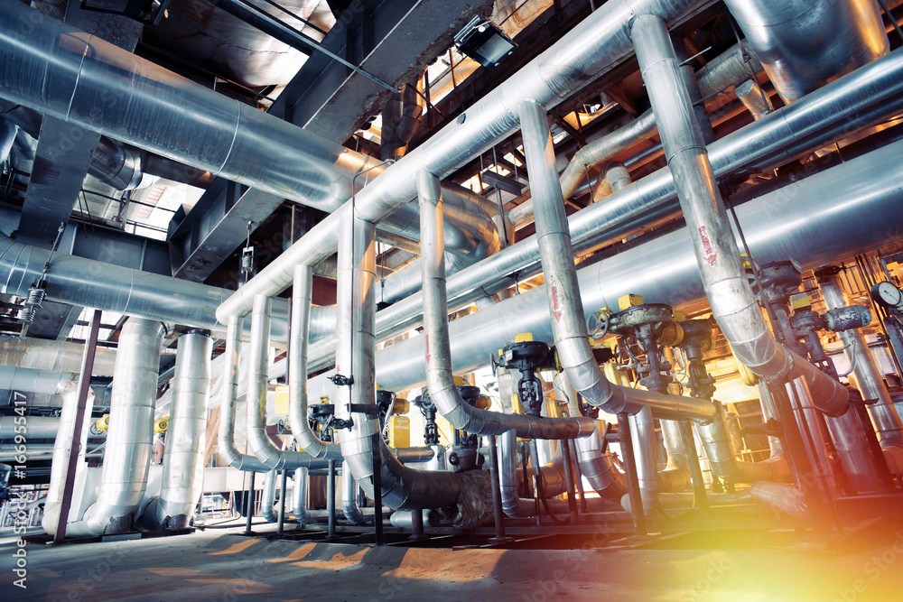 Equipment, cables and piping as found inside of a modern industrial ...