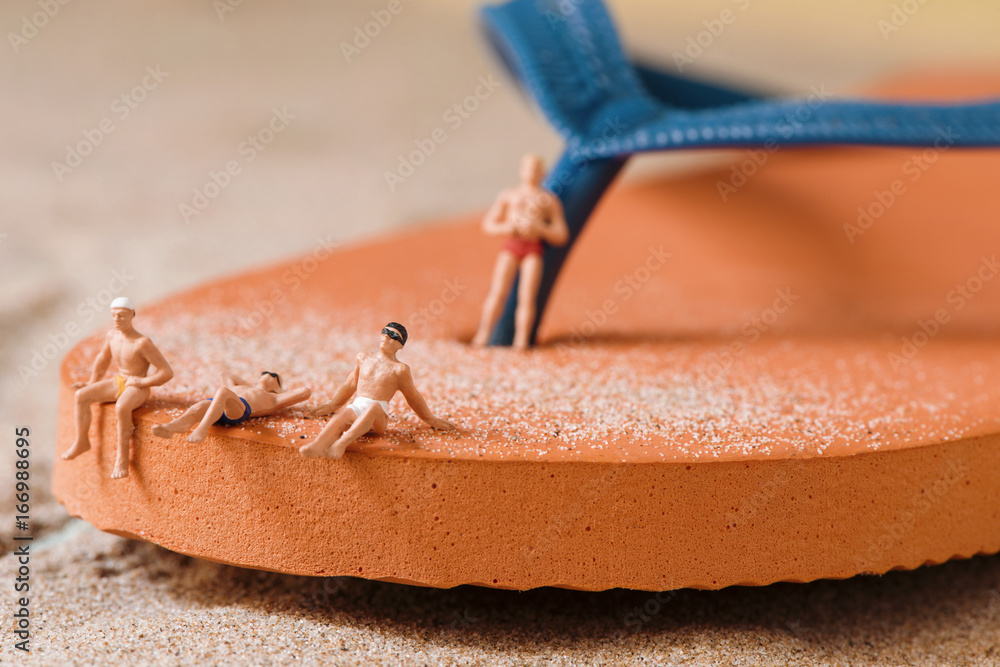miniature people in swimsuit on the beach Stock Photo | Adobe Stock