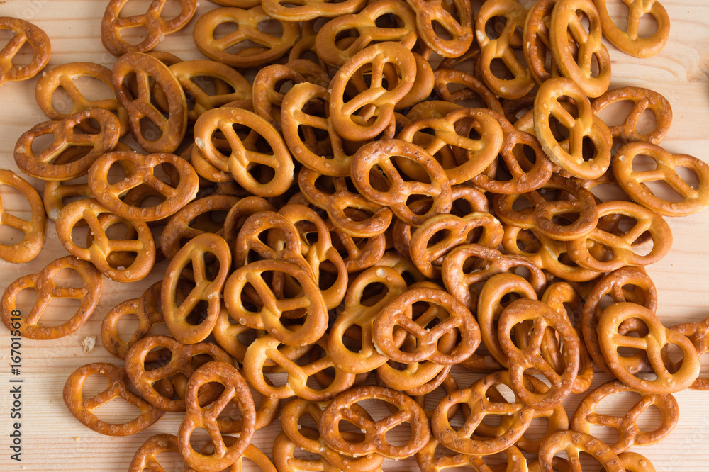 Background texture of salted savory mini pretzels in the traditional ...