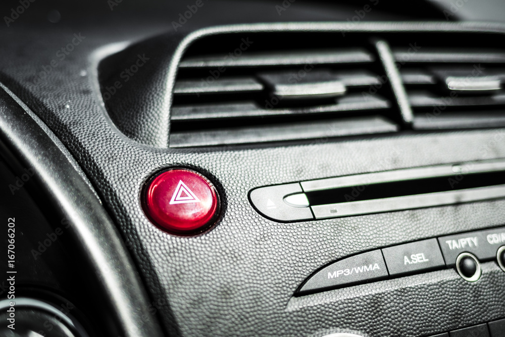 Red warning lights button on a black cockpit car Stock Photo | Adobe Stock