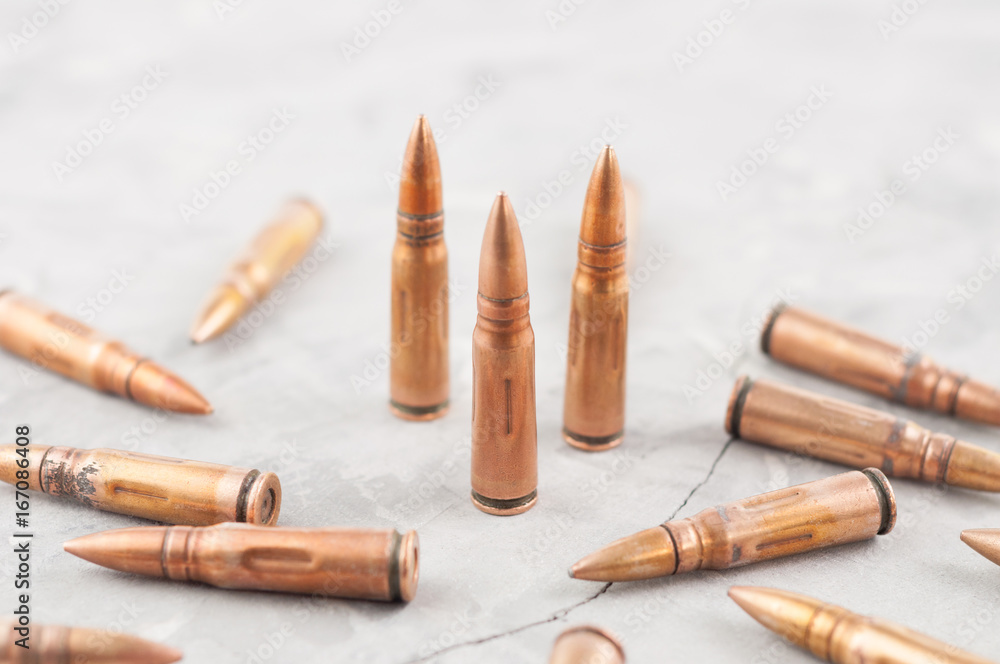 Three metal bullets and many scattered bullets for assault rifle on old ...