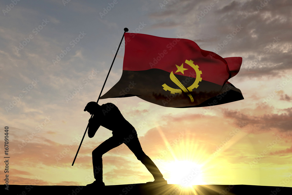 Angola flag being pushed into the ground by a male silhouette. 3D ...