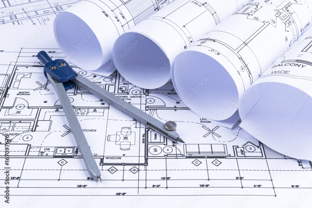 Architectural blueprints and blueprint rolls and a drawing instruments ...
