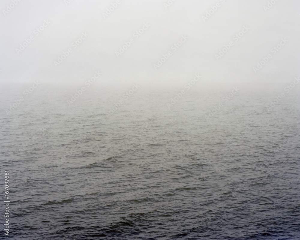 body of water disappearing in the mist Stock Photo | Adobe Stock