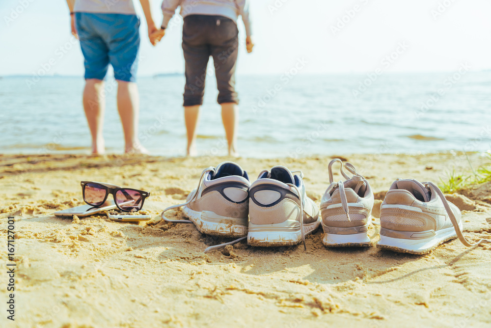 sunglasses with snickers on the beach, couple on background Stock Photo ...