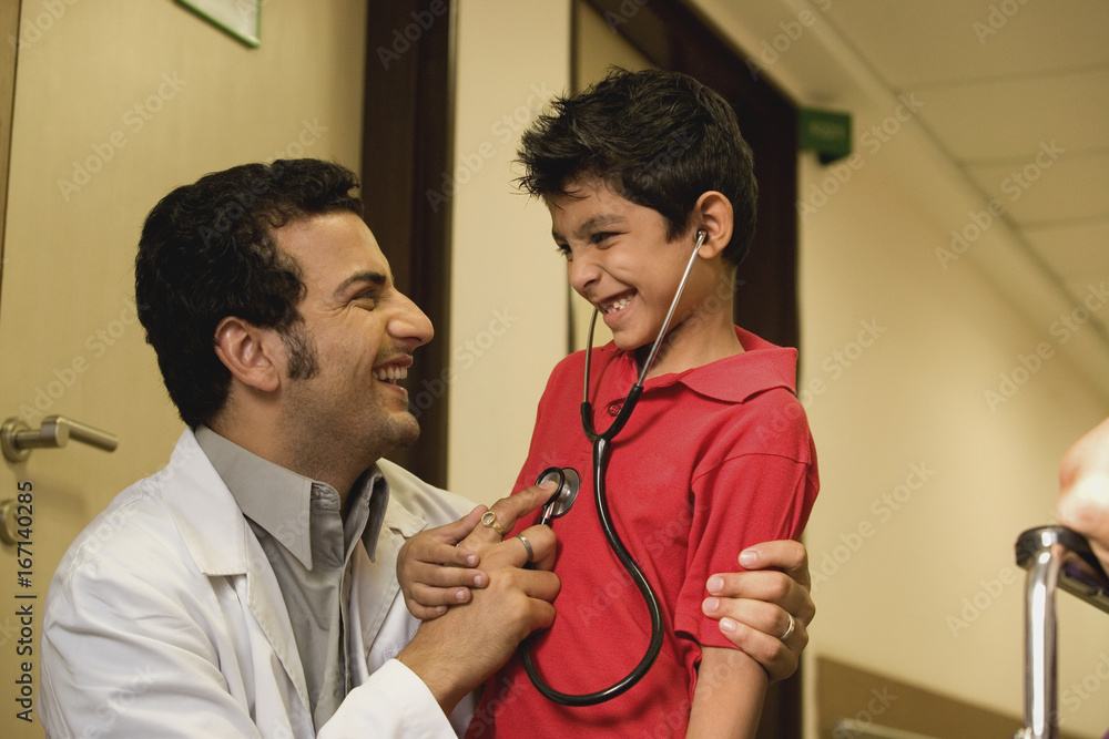 Doctor having fun with his patient Stock Photo | Adobe Stock
