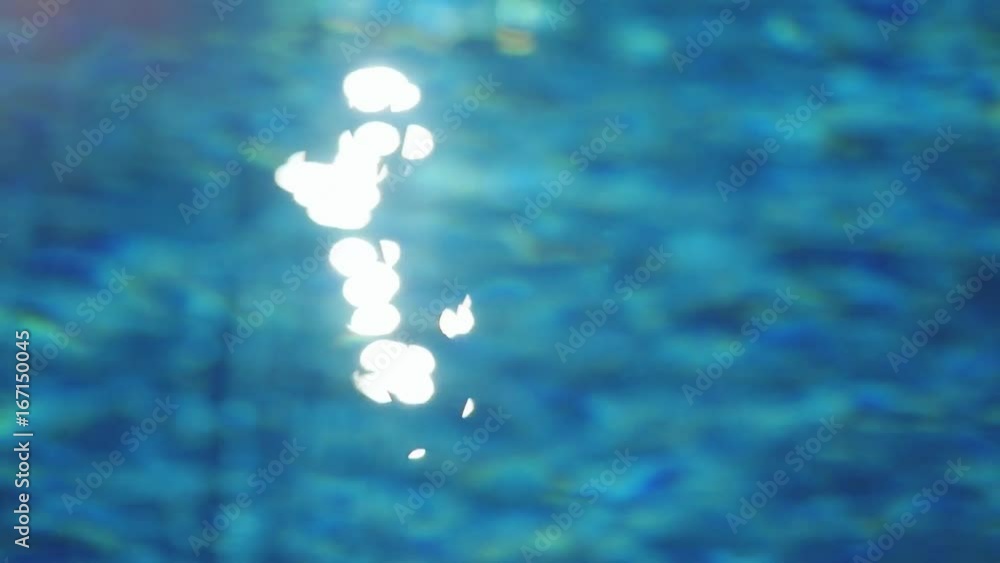 Refraction of sunlight in swimming pool water. Pool water surface ...