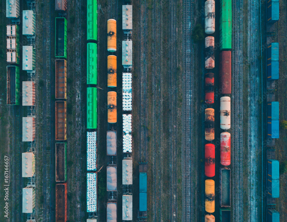 Cargo trains close-up. Aerial view of colorful freight trains on the ...