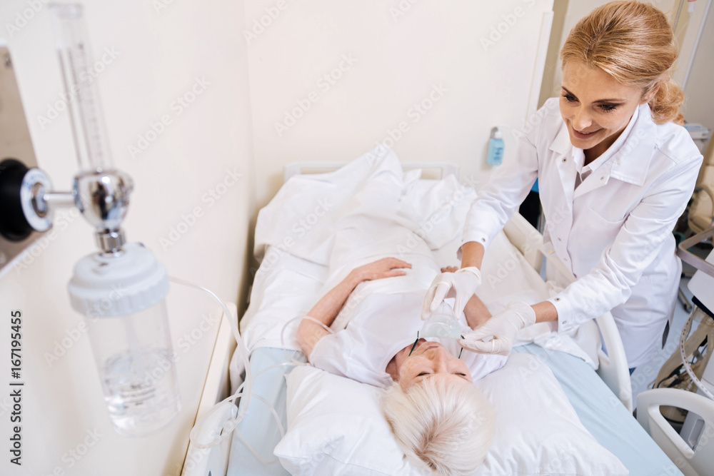 Mindful trained doctor conducting medical procedure Stock Photo | Adobe ...