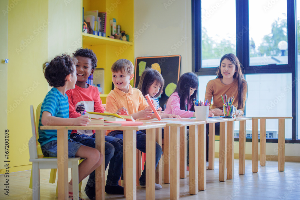 group of preschool kids with teacher kindergartner in attention of ...