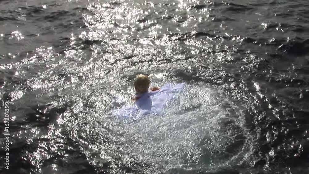 Video „Model in costume of angel jumping into water from ship in Red ...