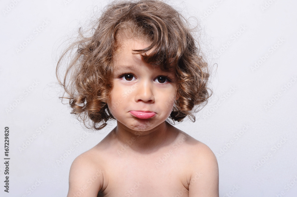 Portrait of a beautiful sad boy. Toddler feeling sadness because he was ...