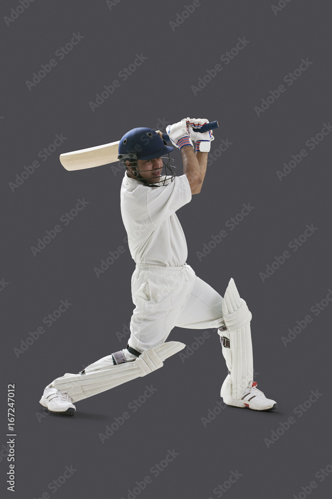 Young man playing cricket isolated over gray background Stock Photo ...