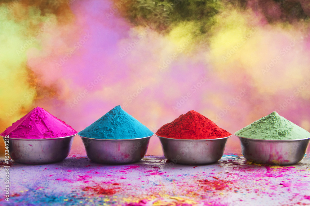 Containers of colorful Holi power arranged on floor Stock Photo | Adobe ...