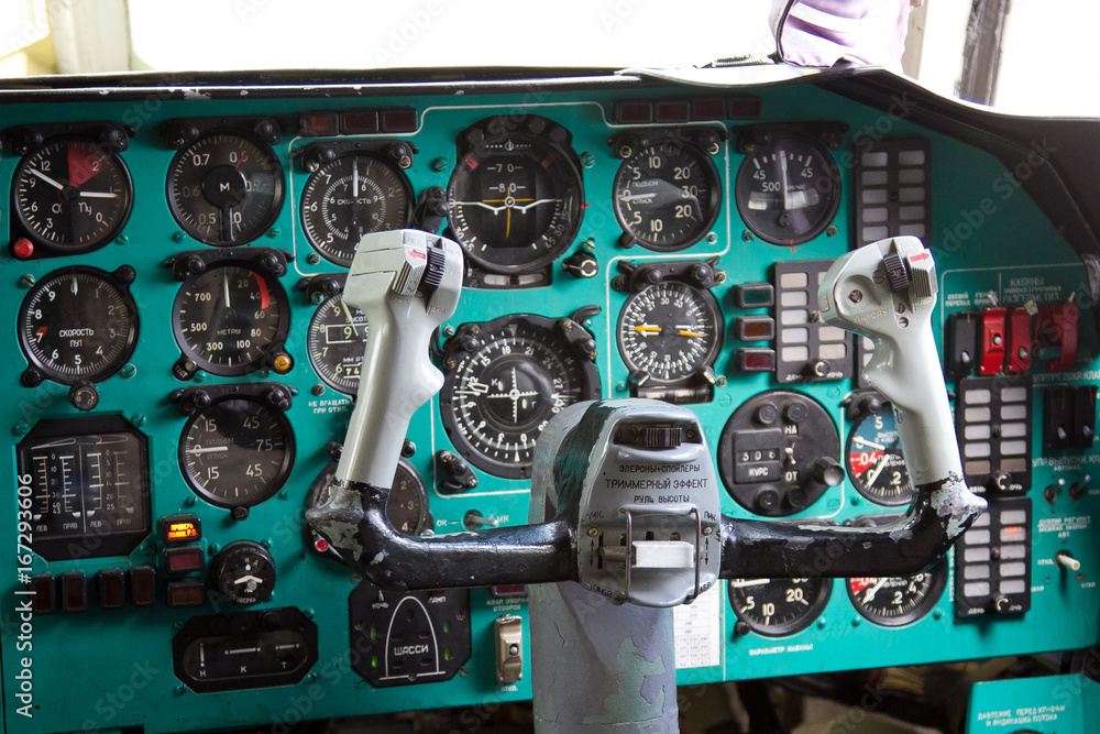 Cargo airplane IL-76M cockpit interior. Dashboard and steering wheel ...